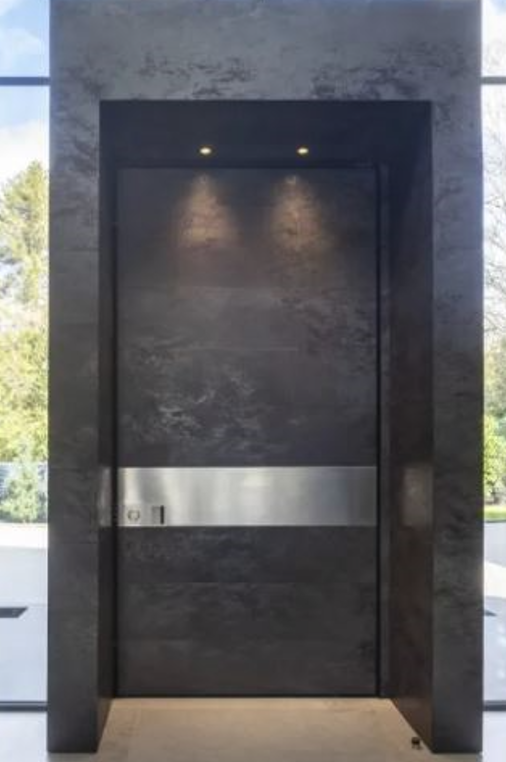Cascade Marble Pivot Door – Custom Iron Door Pros